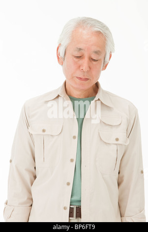 Studio shot of Japanese man thinking in black and white Stock Photo - Alamy
