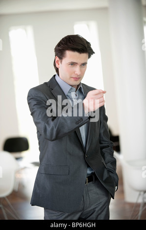Business man, pointing forward - focus on finger Stock Photo - Alamy
