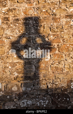 Shadow of a cross on a wall Stock Photo - Alamy