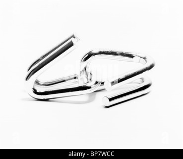 Linked metal puzzle Stock Photo - Alamy