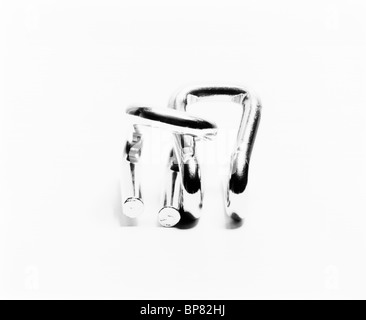 Linked metal puzzle Stock Photo - Alamy
