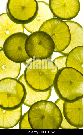 Round slices lime laid on a background clearance Stock Photo - Alamy