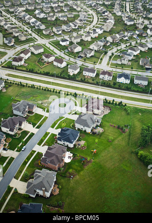 Aerial picture of rows of identical suburban homes in a subdivision in ...