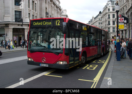 red bendy bus window bus public transport stop Stock Photo - Alamy