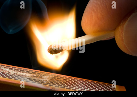 Lit Match with a Flame Flaring Up After Being Struck Stock Photo - Alamy