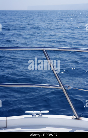 Sailboat bow with stainless steel railing and marine equipment in ...