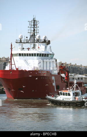 Offshore supply vessels and anchor handling tug ships anchored at open ...