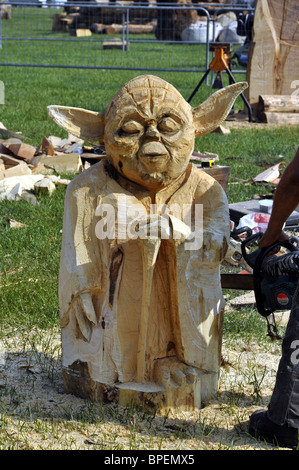 Competitor using a chainsaw in the Woodfest Wood Carving competition St ...