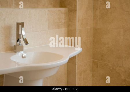 Contemporary wash hand basin, taps and tiled splashback Stock Photo - Alamy
