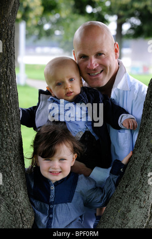 Happy middle class family of four checking a direction in the city map ...