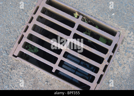 Cast iron storm drain grate Stock Photo - Alamy