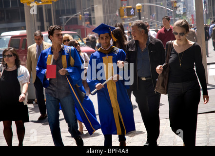 Graduates from Pace University celebrating in New York City following ...