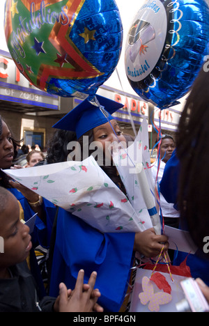Graduates from Pace University celebrating in New York City following ...