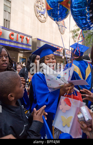 Graduates from Pace University celebrating in New York City following ...