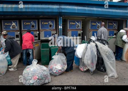 Homeless man in NYC collecting cans to take to recycle and get money in ...