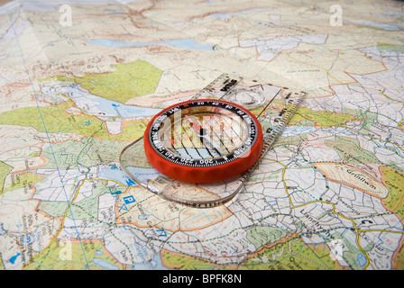 Compass on an Ordnance Survey map, UK Stock Photo - Alamy