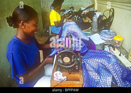 Women working sewing machine at a tailor's shop, HIV/AIDS aid Stock ...