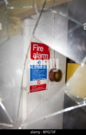 A broken 'break glass' fire alarm over a white background Stock Photo ...