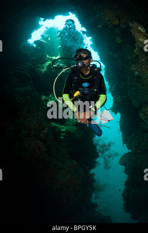 Cave exploration, exploring a cavern. Narrow path in caves and caverns ...