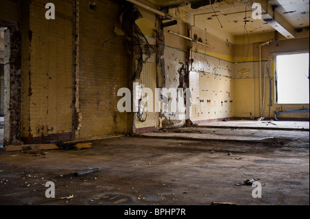 A derelict abandoned uninhabited building interior room with peeling ...