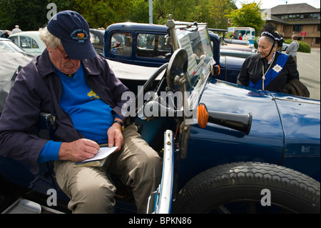 Queen Victoria looking at restored classic motor cars on show during ...