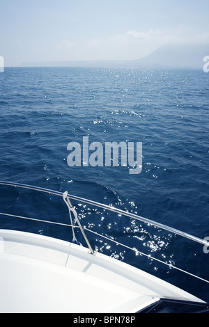Sailboat bow with stainless steel railing and marine equipment in ...