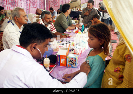 Doctor examines patients at affectees relief camp established at ...