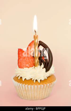 Delicious birthday cake with cupcakes on wooden background Stock Photo ...
