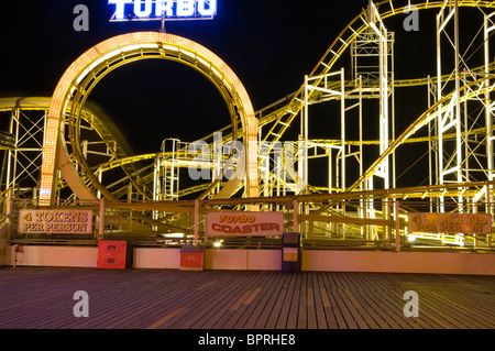 The Turbo Funfair Ride Illuminated At Night On Brighton Pier East ...