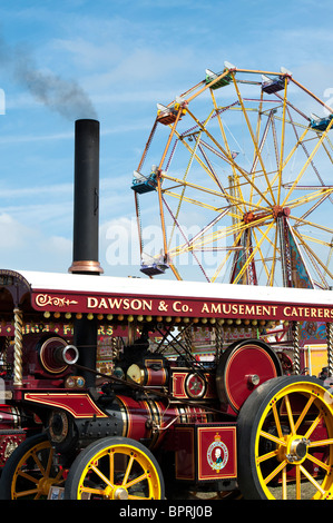 Showmans Traction Engine in front of a steam fairground ride at the ...