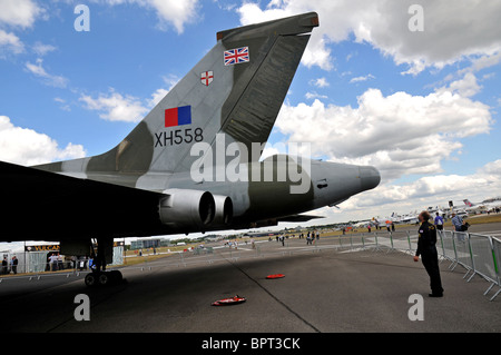 An RAF delta-wing Vulcan bomber in flight, underside view from ground ...