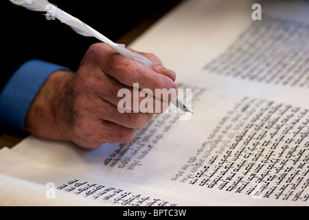 A sofer, or Jewish scribe, painstakingly transcribes the words of the ...