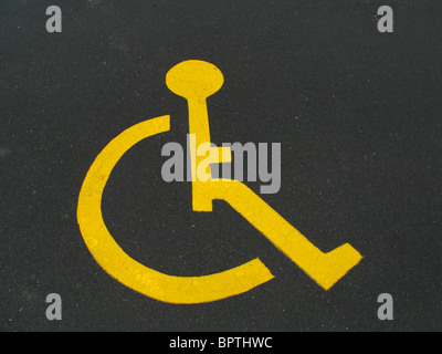 yellow wheelchair handicap road sign painted on a pavement Stock Photo ...