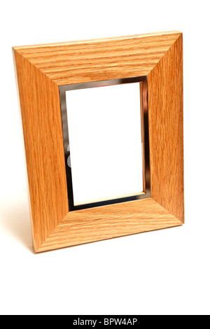 A vertical shot of a wooden picture frame in a rural area in cloudy sky ...