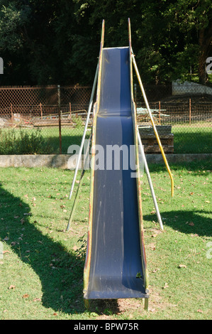 old slide playground traditional metal in school children countryside ...