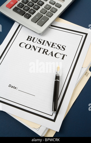 Business Contract and calculator close up Stock Photo - Alamy