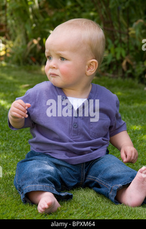baby boy looking apprehensive worried scared Stock Photo - Alamy
