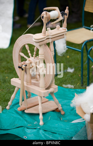 Traditional spinning wheel demonstration at a country fair, UK Stock ...