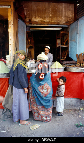 Sana'a Yemen Women wearing Sana'ani Sitrah Dress Shopping at Souk Stock ...