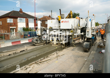 Slip Form Concrete Paver Machine on construction highway. Building ...
