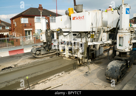 Slip Form Concrete Paver Machine on construction highway. Building ...