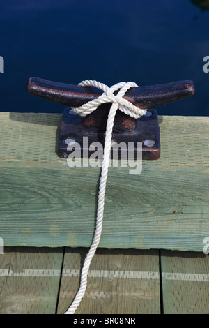 Colourful abstract of a mooring cleat with a rope tied to it Stock ...