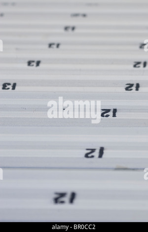 Seat numbers marked on aluminum grandstand seats Stock Photo - Alamy