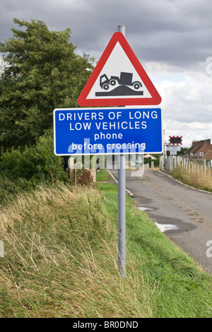 Risk of grounding sign for long low vehicles on a railway crossing ...