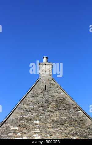 Stone building, gable end wall / detail of weathered sandstone ...