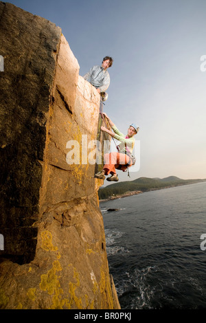 Rock Climbing on oceanside cliffs Stock Photo - Alamy