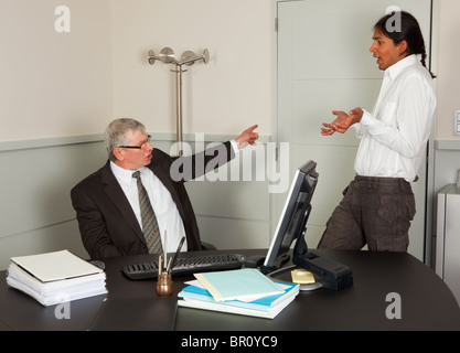 Very angry director firing one of his young employees Stock Photo - Alamy