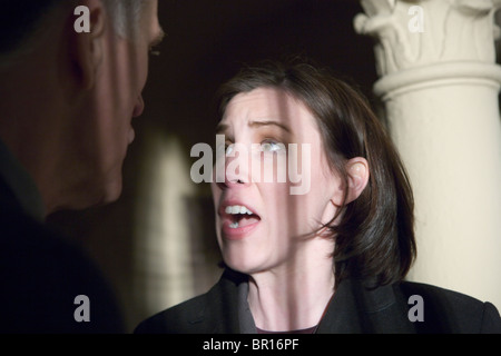 Woman and man having an intense conversation after seeing a message on ...