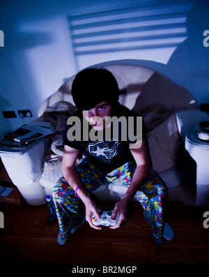 Teenager play on his Xbox 360 games console Stock Photo - Alamy