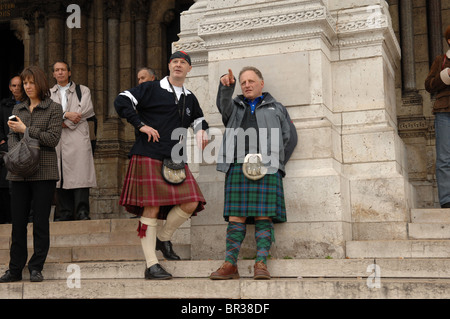 Scotsmen in kilts showing off their legs in Paris 2006 Stock Photo - Alamy